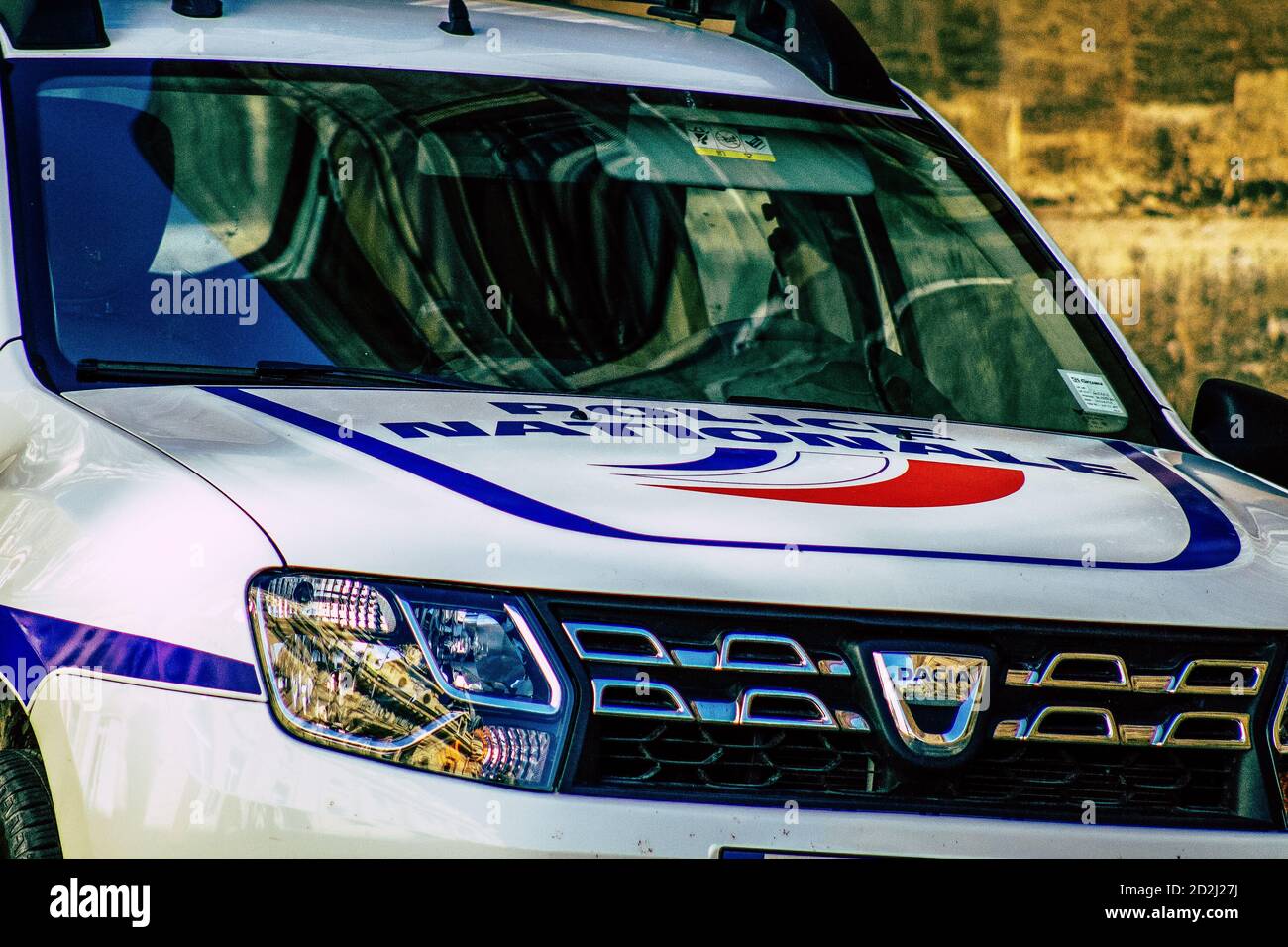 Closeup of an official police car patrolling the streets of the city ...