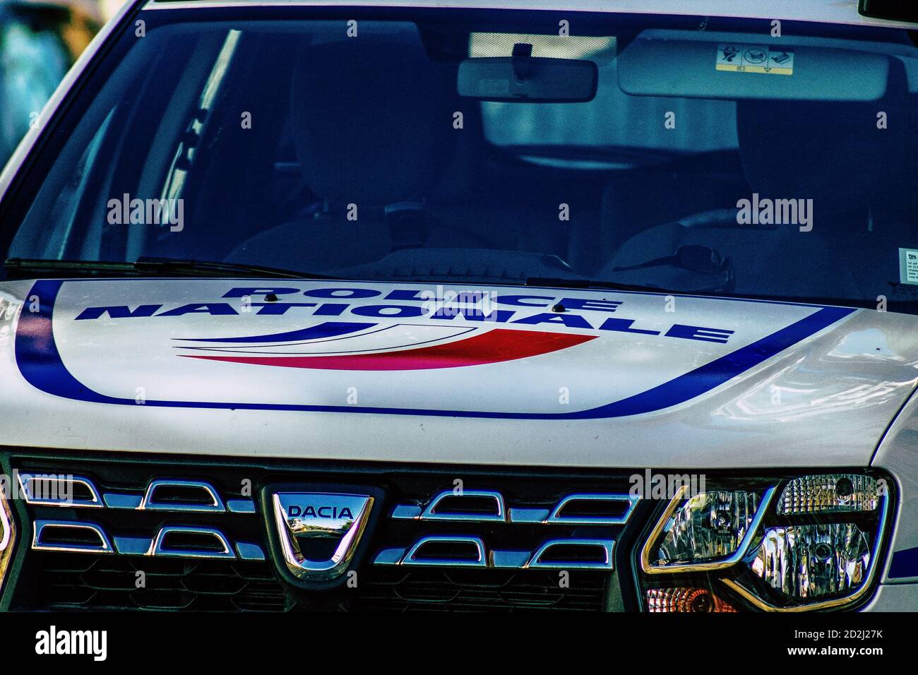 Closeup of an official police car patrolling the streets of the city ...