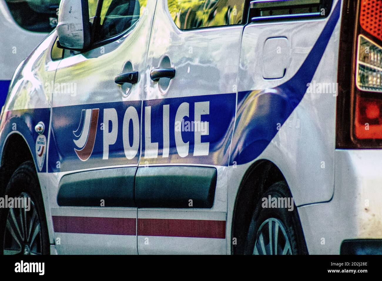 Closeup of an official police car patrolling the streets of the city ...