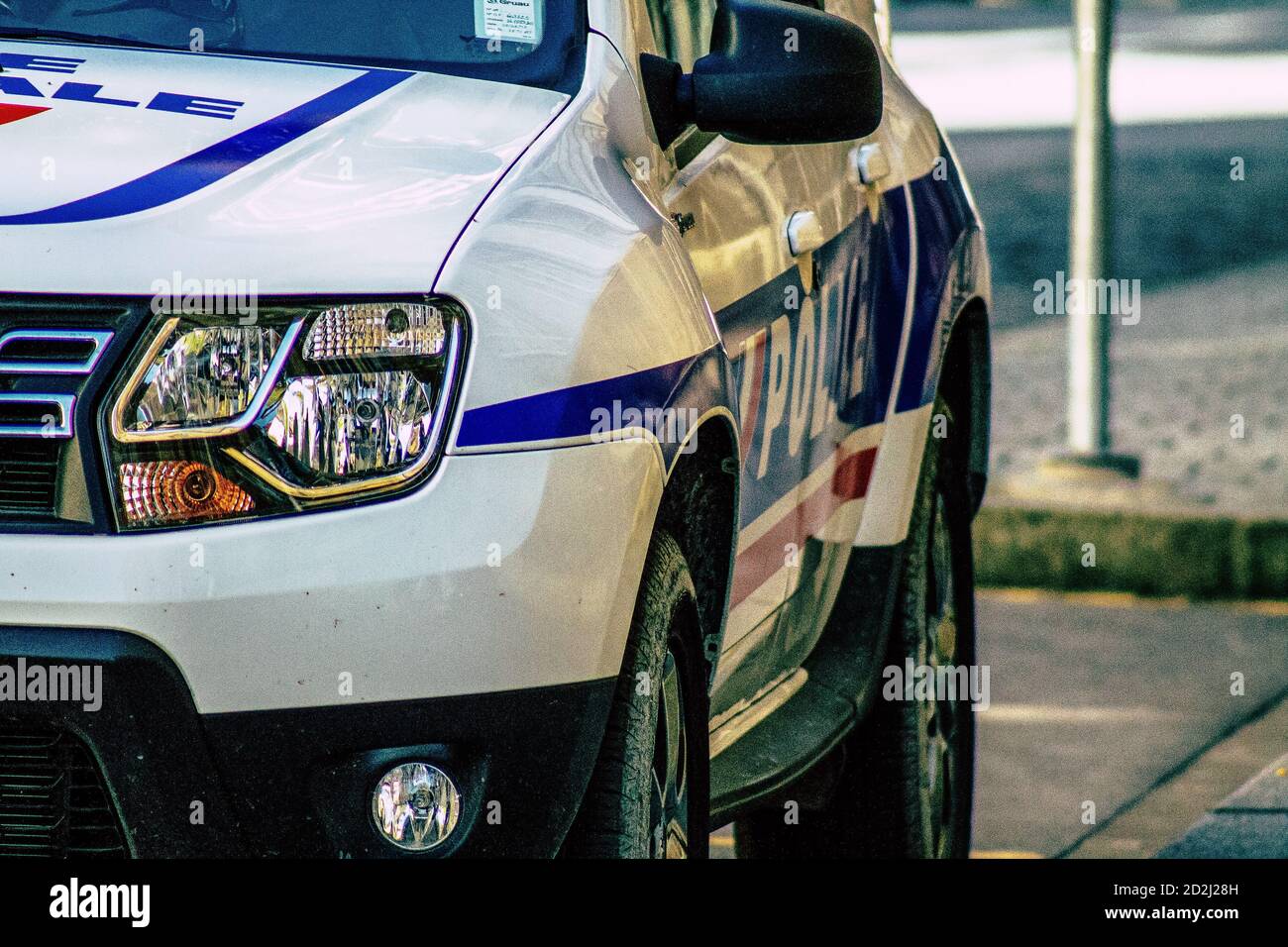 Closeup of an official police car patrolling the streets of the city ...