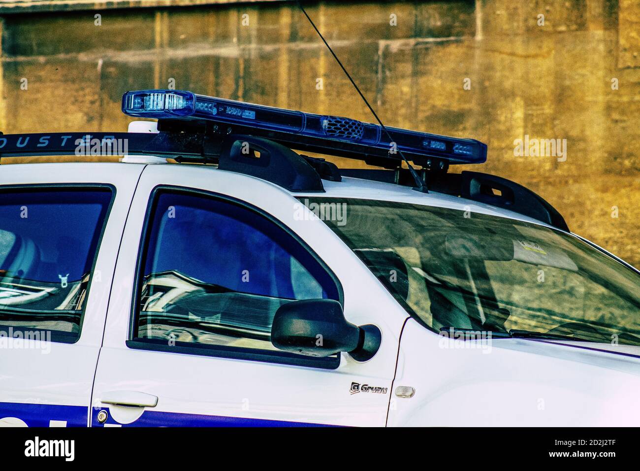 Closeup of an official police car patrolling the streets of the city ...