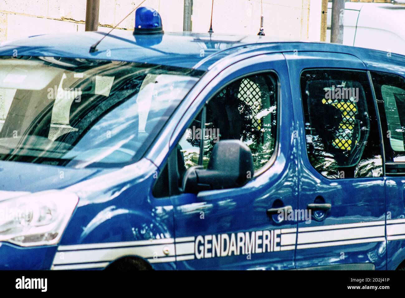 Closeup of an official police car patrolling the streets of the city ...