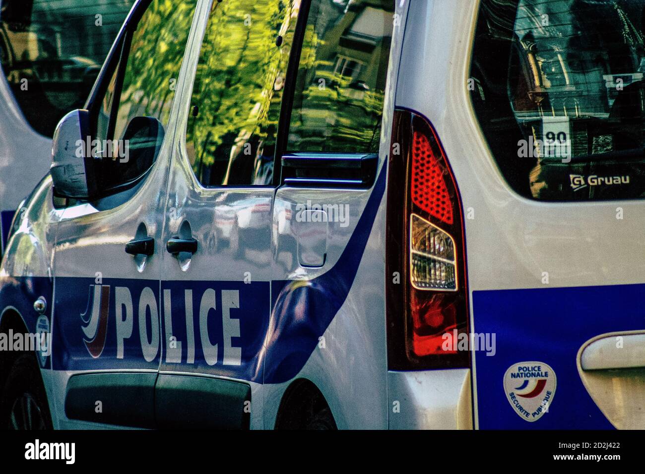 Closeup of an official police car patrolling the streets of the city ...