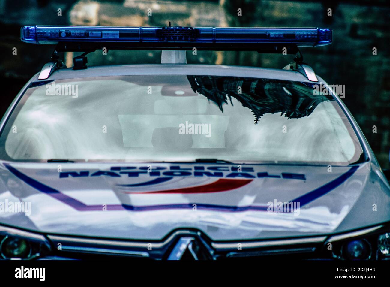 Closeup of an official police car patrolling the streets of the city ...