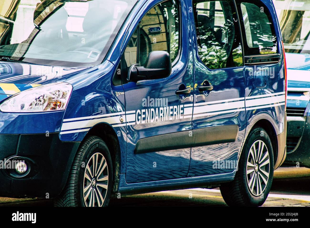 Closeup of an official police car patrolling the streets of the city ...