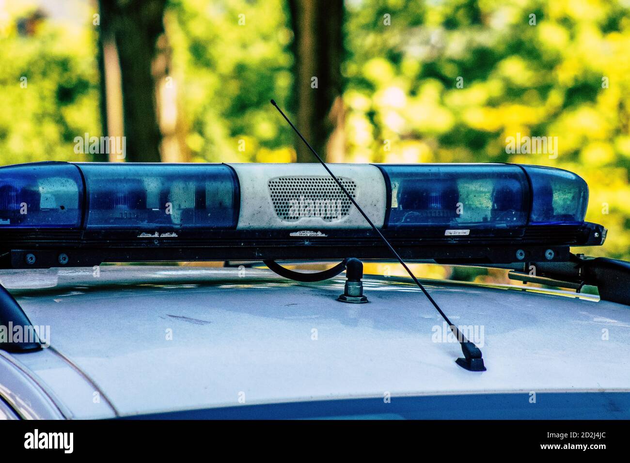 Closeup of an official police car patrolling the streets of the city ...