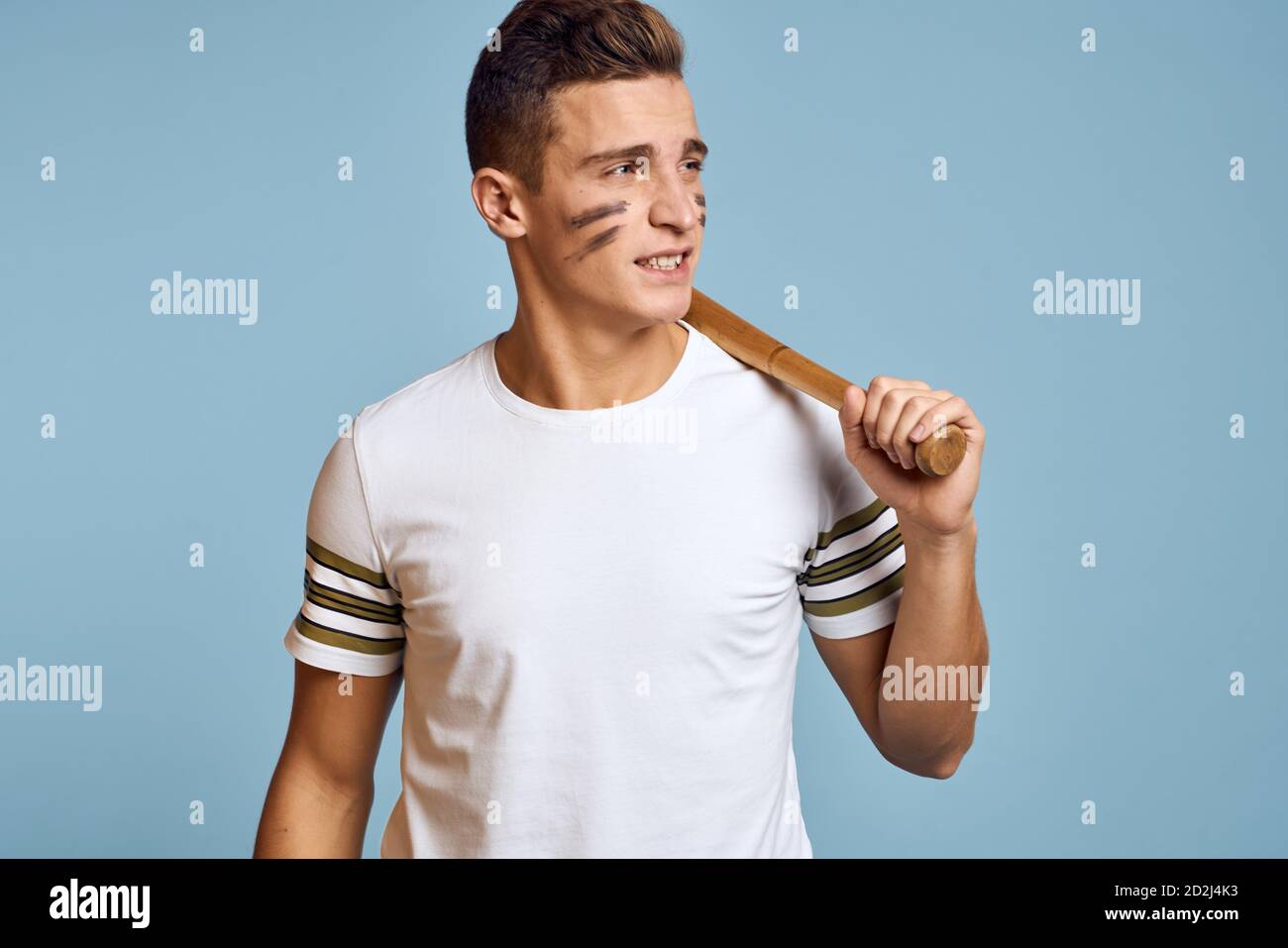 baseball guy with a bat in his hand on a blue background and a combat ...