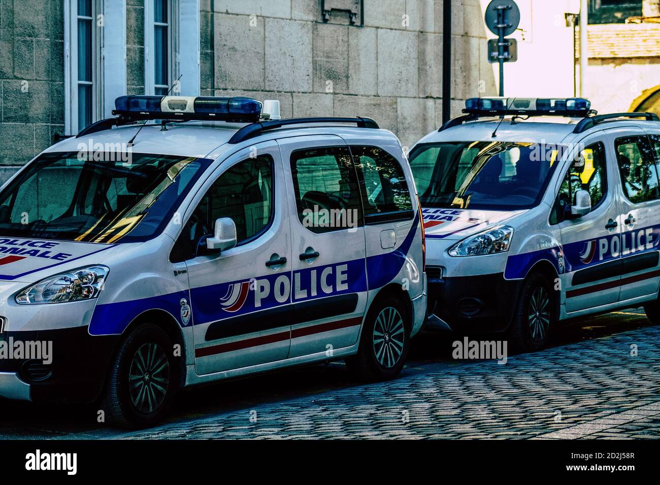 Closeup of an official police car patrolling the streets of the city ...