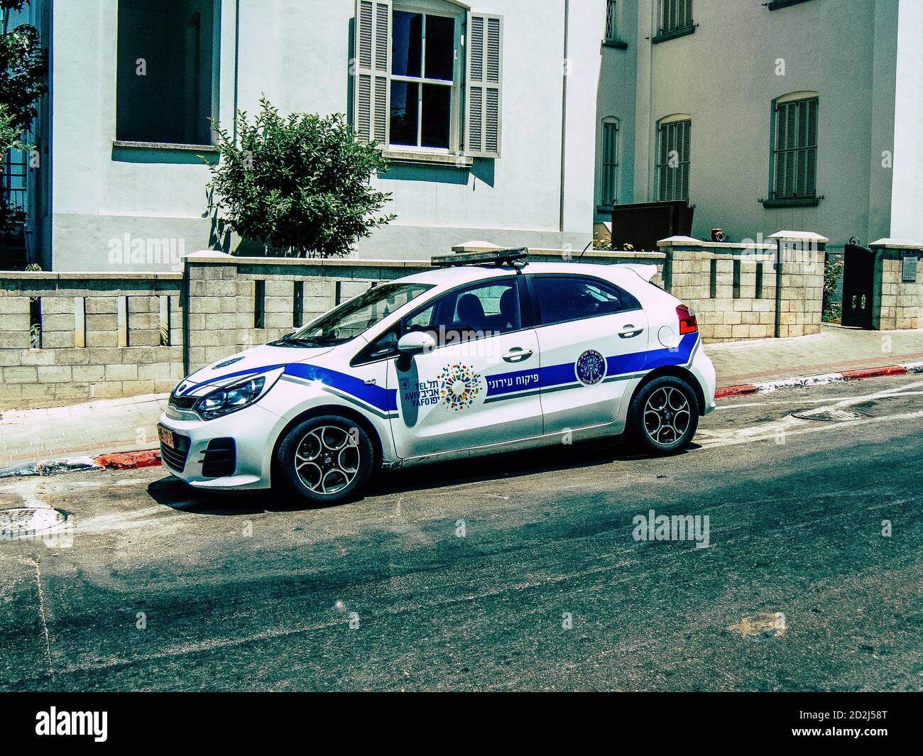 Closeup of an official police car patrolling the streets of the city ...