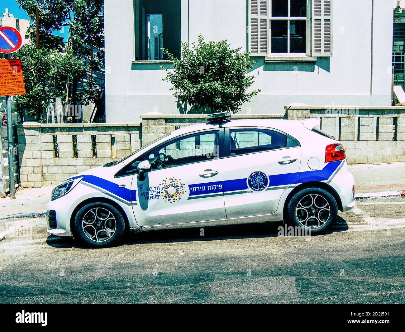 Closeup of an official police car patrolling the streets of the city ...