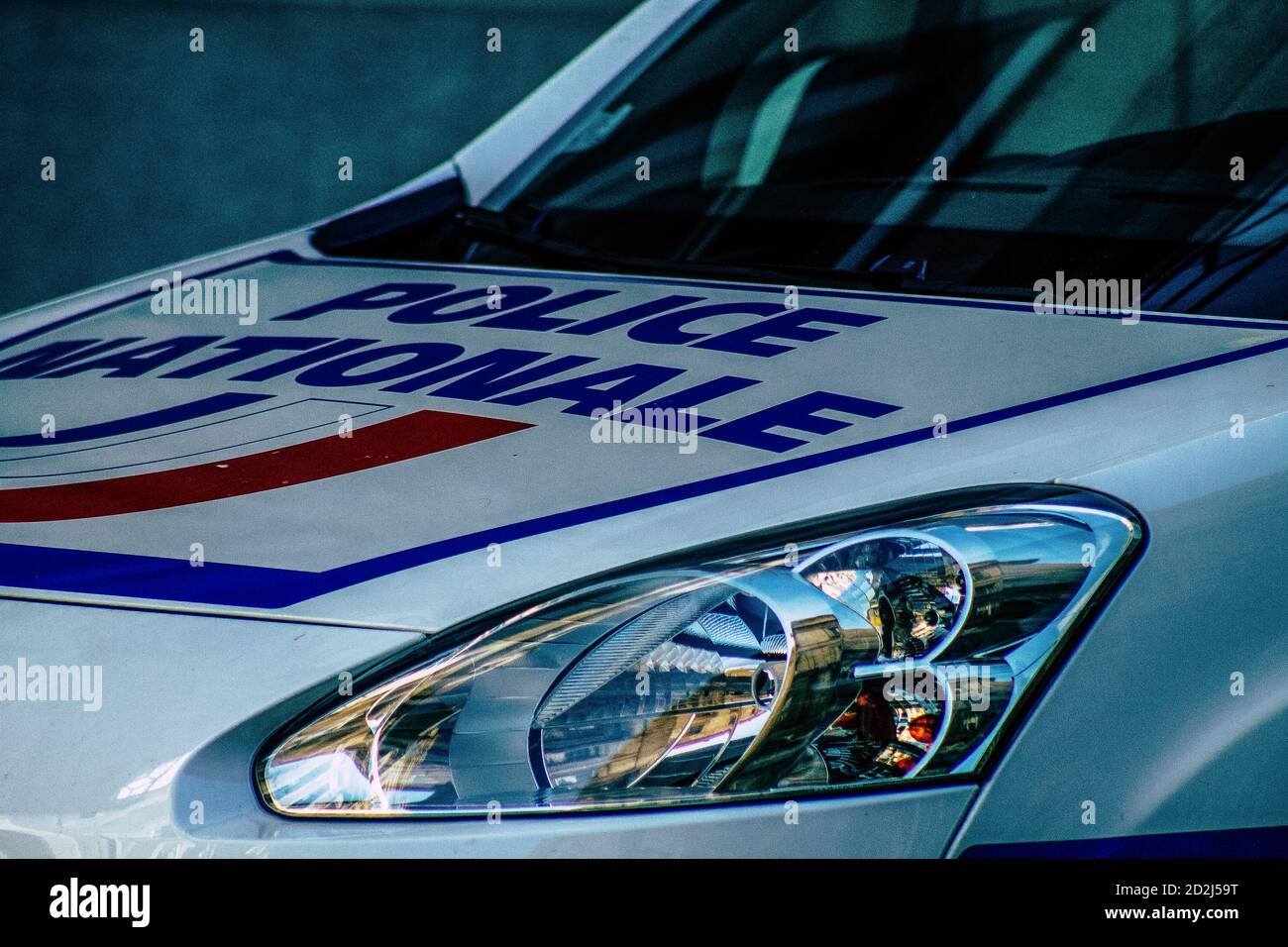 Closeup of an official police car patrolling the streets of the city ...