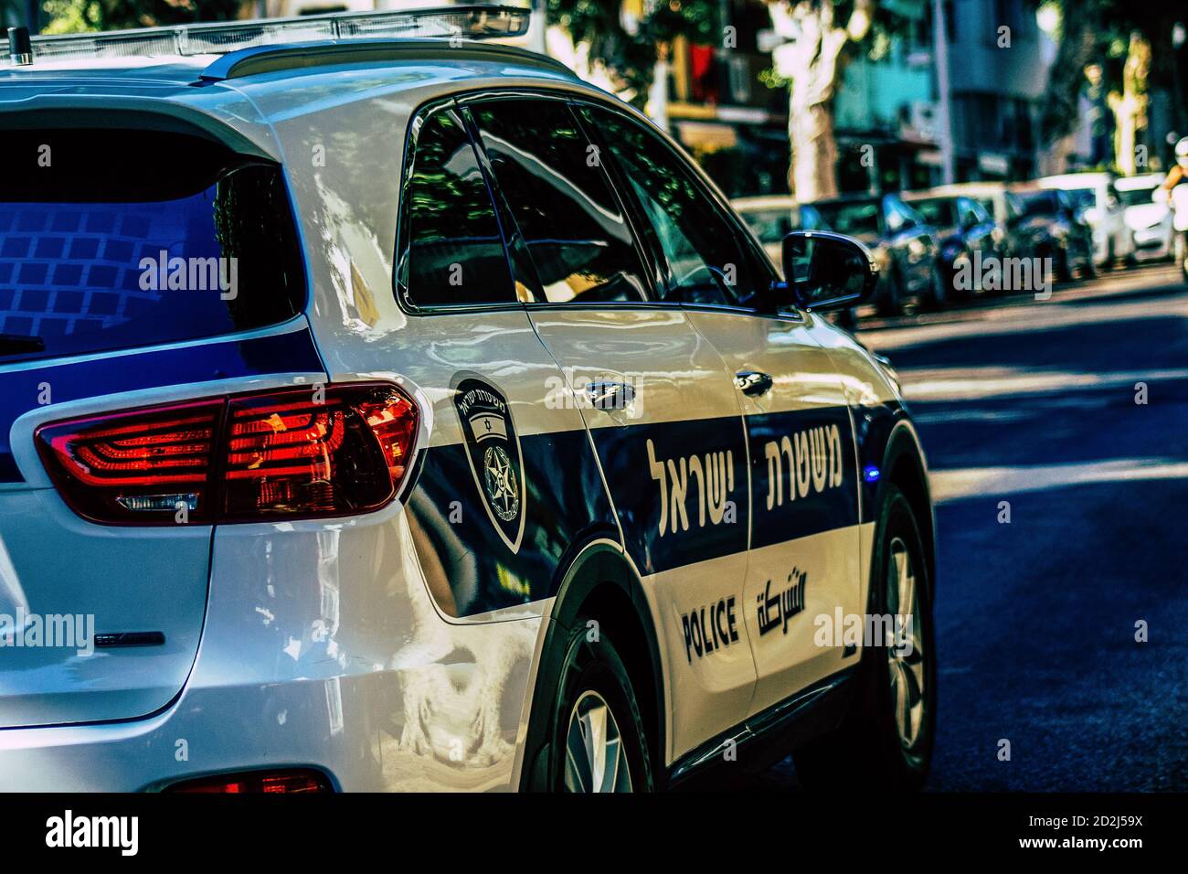 Closeup of an official police car patrolling the streets of the city ...