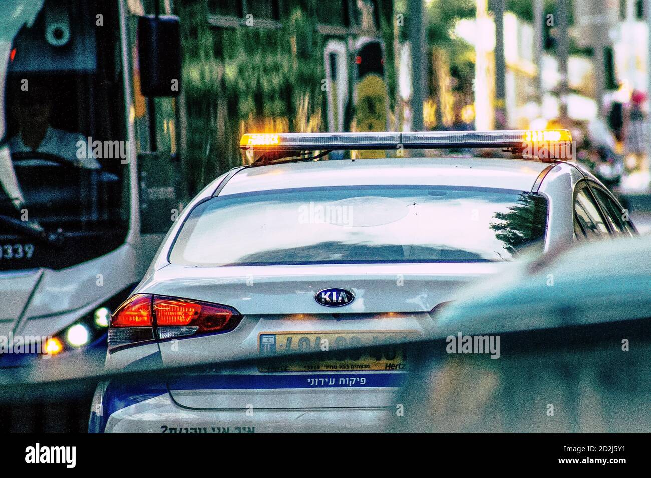 Closeup of an official police car patrolling the streets of the city ...