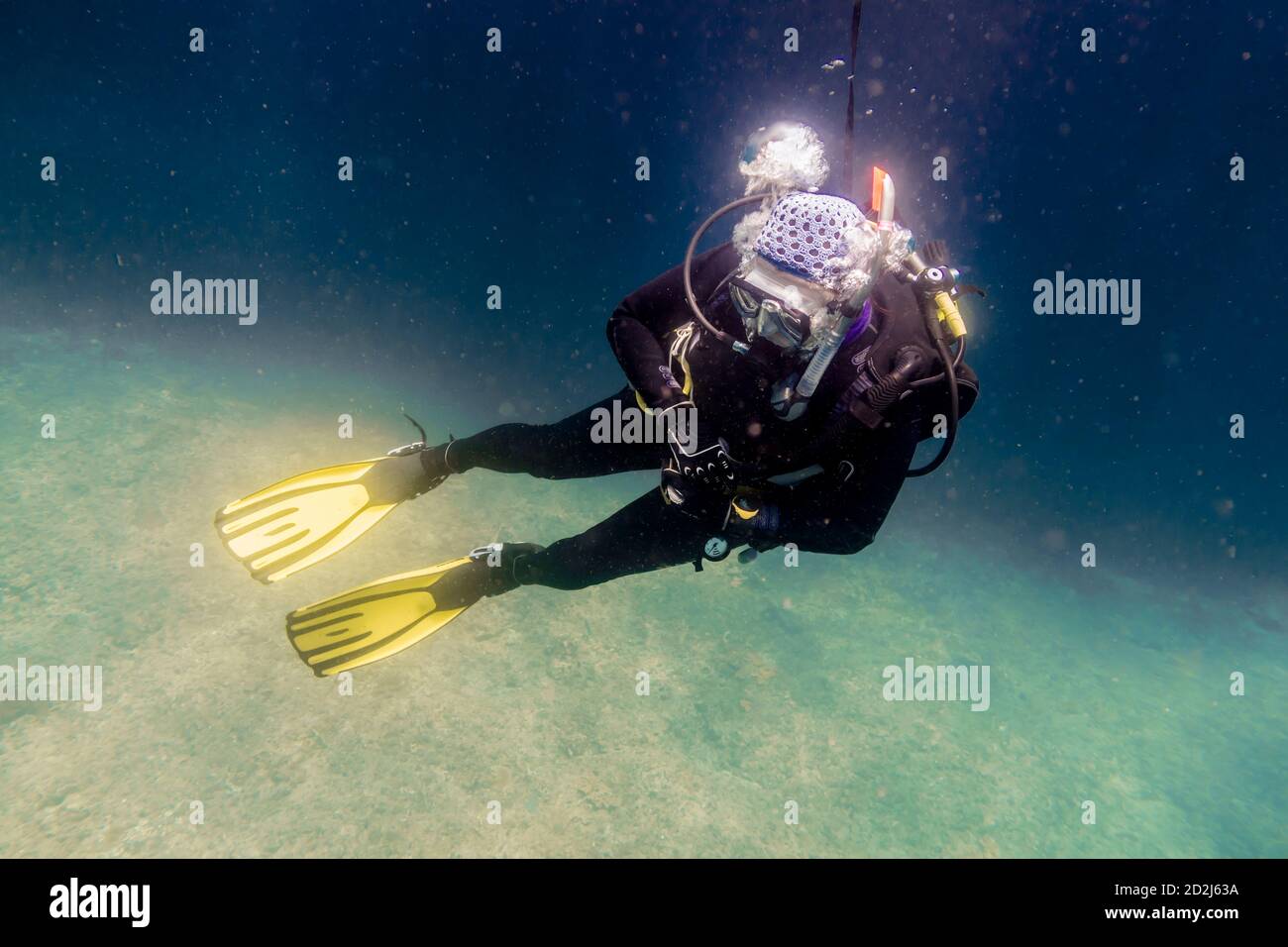 Diver rising to the surface from the depths of the sea Stock Photo - Alamy