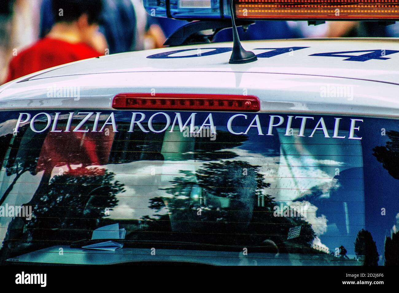 Closeup of an official police car patrolling the streets of the city ...