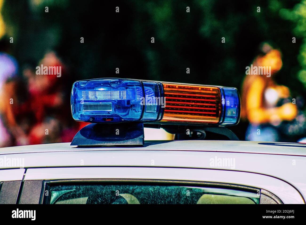 Closeup of an official police car patrolling the streets of the city ...
