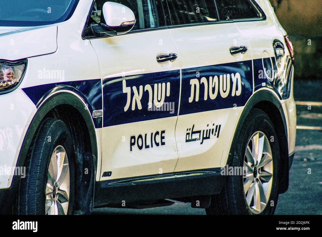 Closeup of an official police car patrolling the streets of the city ...