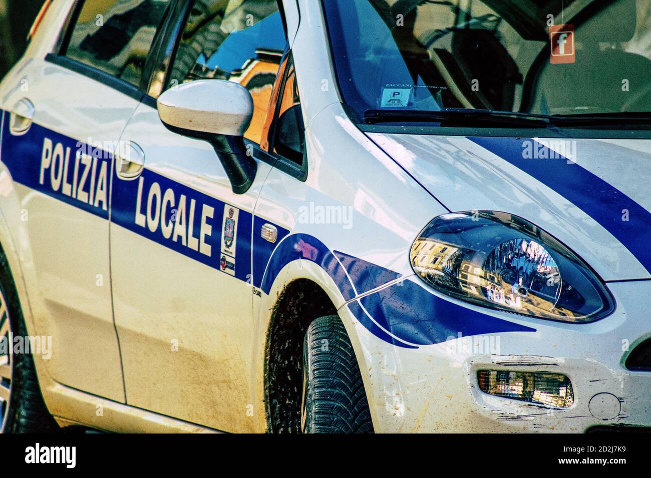Closeup of an official police car patrolling the streets of the city ...