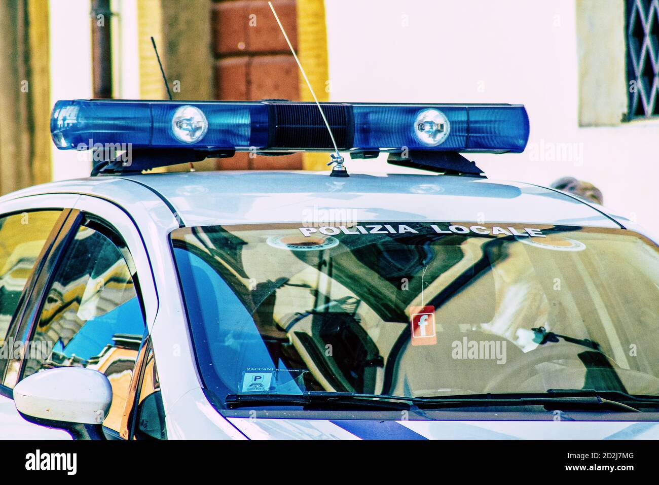 Closeup of an official police car patrolling the streets of the city ...