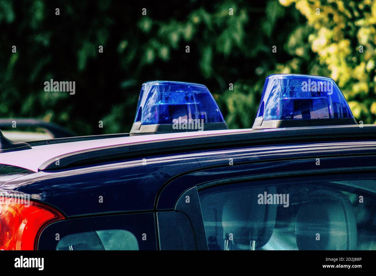 Closeup of an official police car patrolling the streets of the city ...