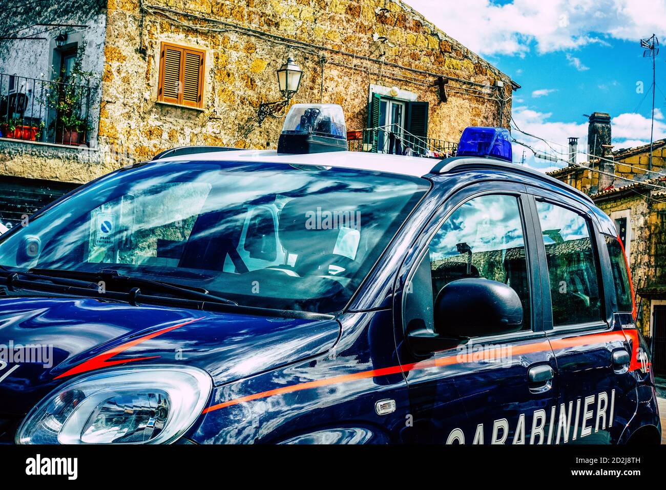 Closeup of an official police car patrolling the streets of the city ...
