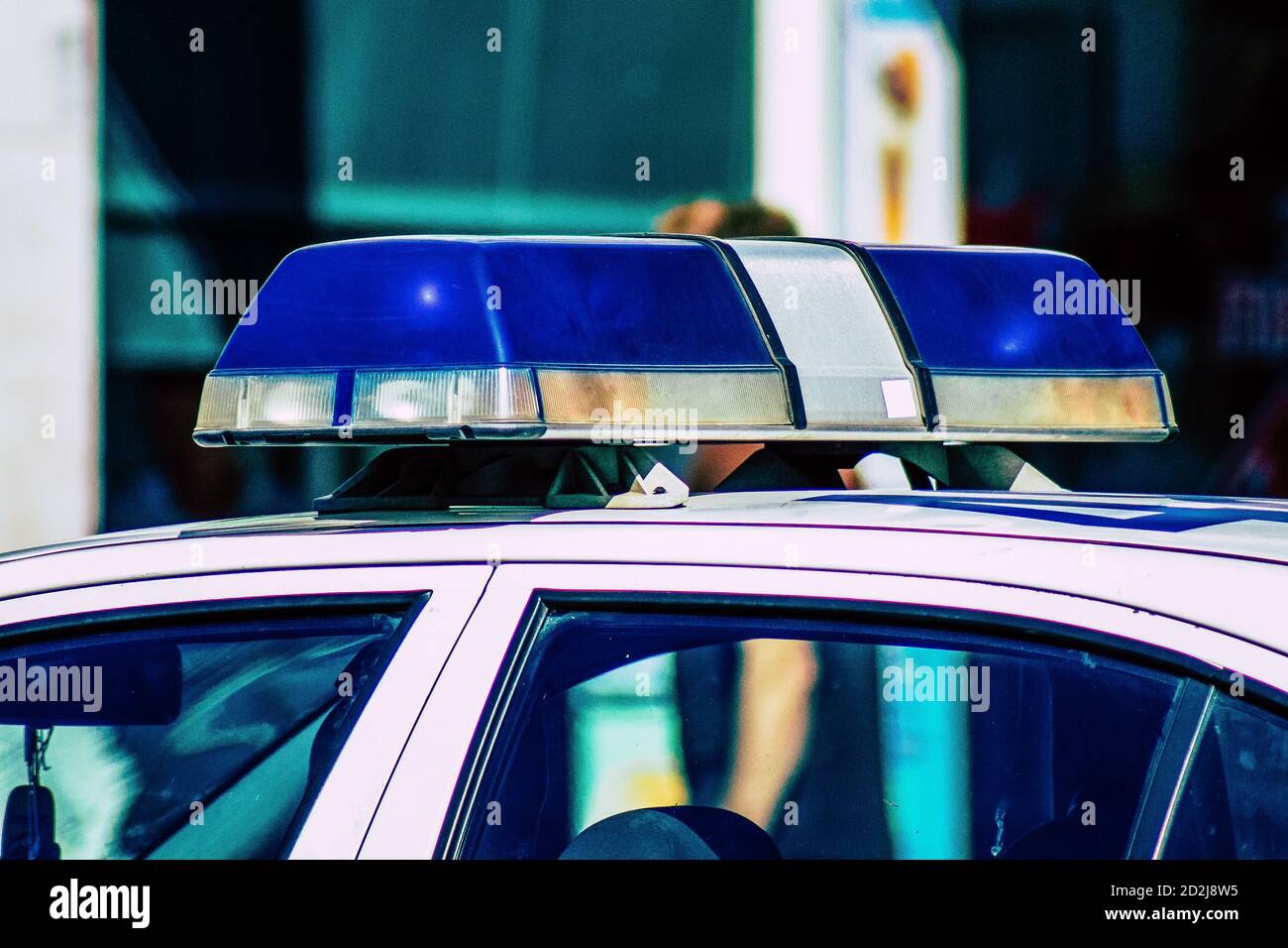 Closeup of an official police car patrolling the streets of the city ...