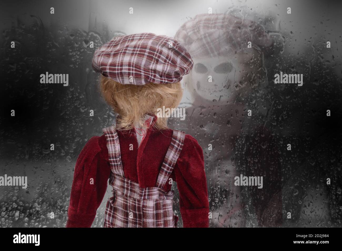 Reflection of ghost doll from windows with rain drop in dark night ...