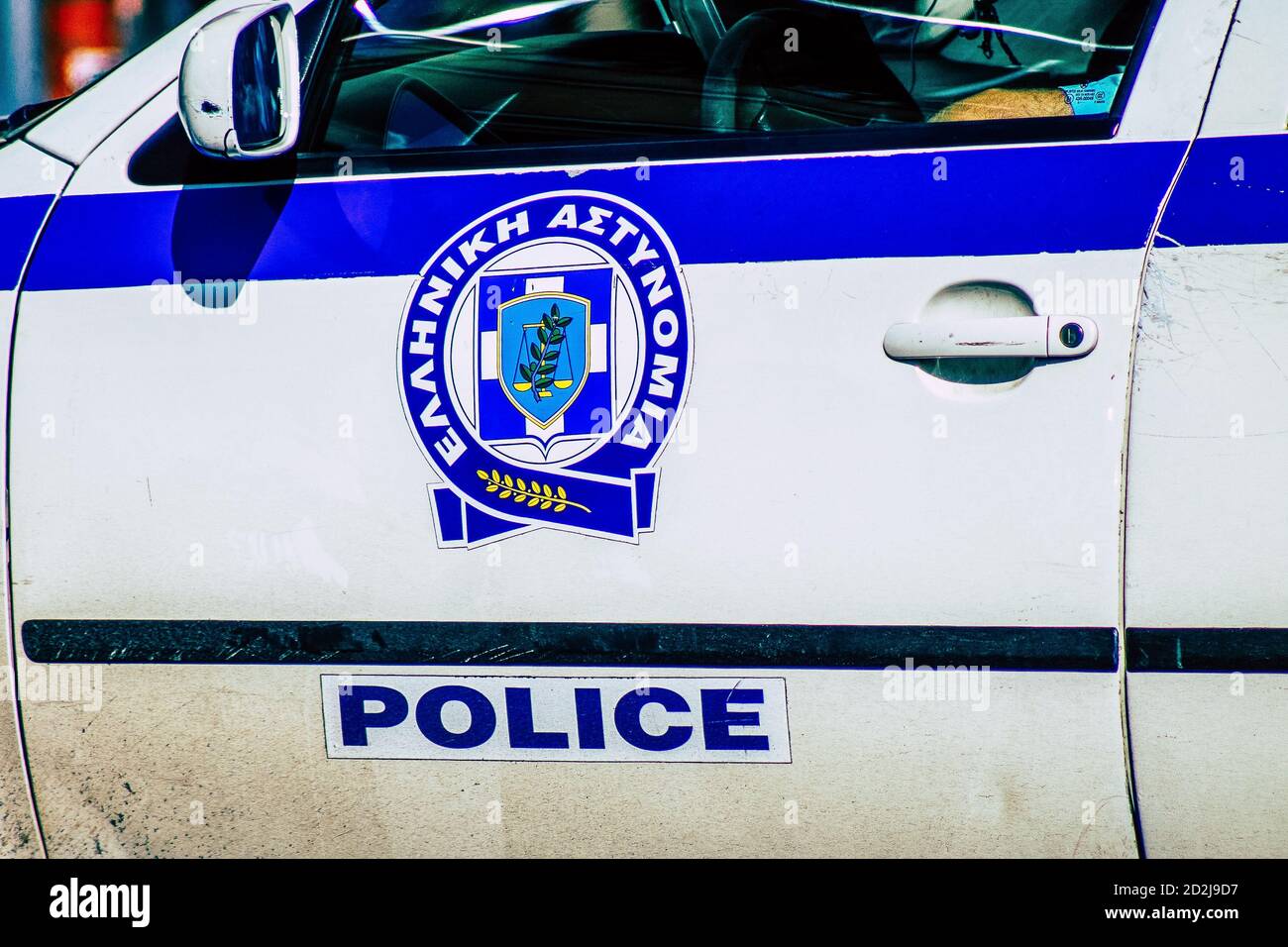 Closeup of an official police car patrolling the streets of the city ...