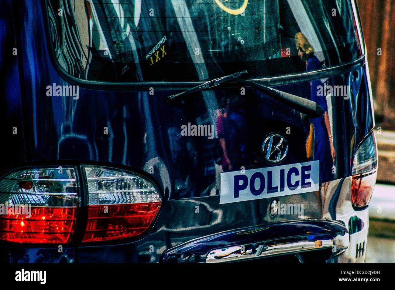 Closeup of an official police car patrolling the streets of the city ...