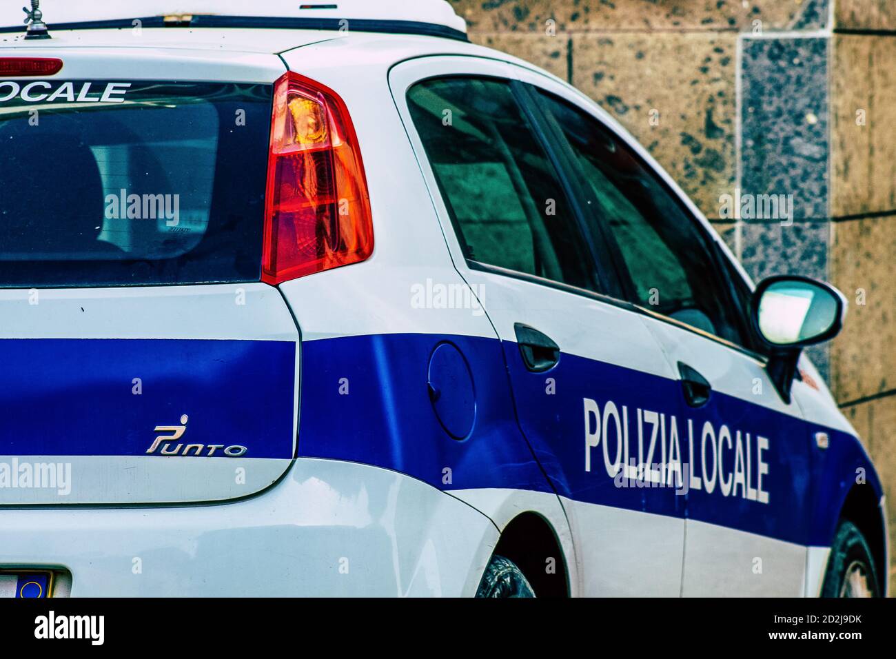 Closeup of an official police car patrolling the streets of the city ...