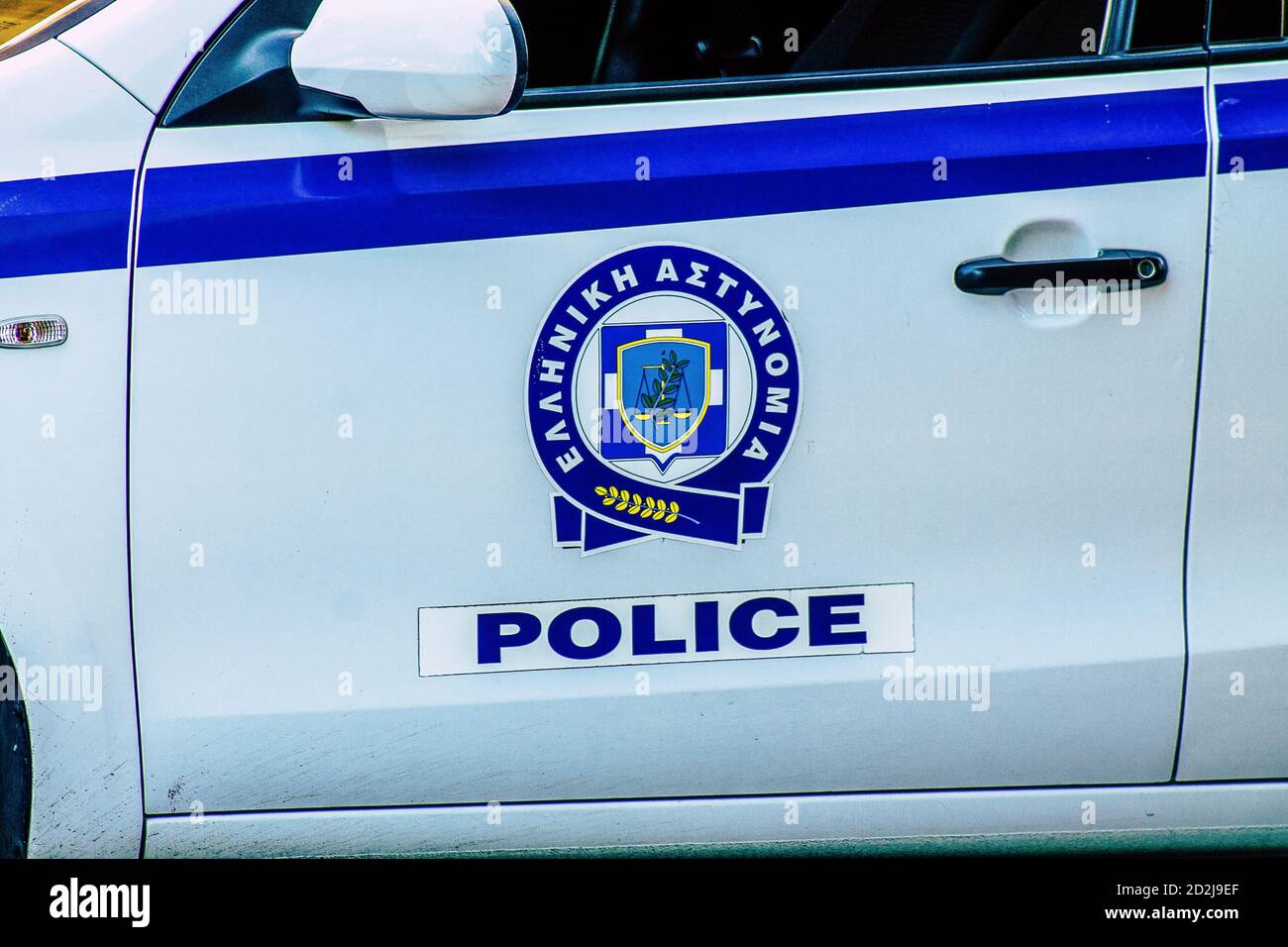 Closeup of an official police car patrolling the streets of the city ...