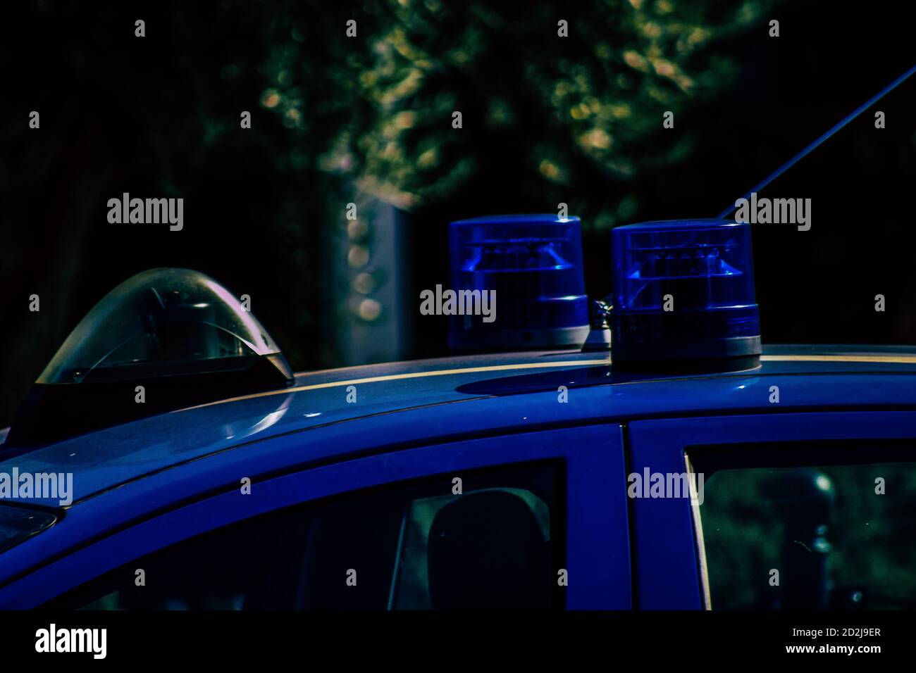 Closeup of an official police car patrolling the streets of the city ...