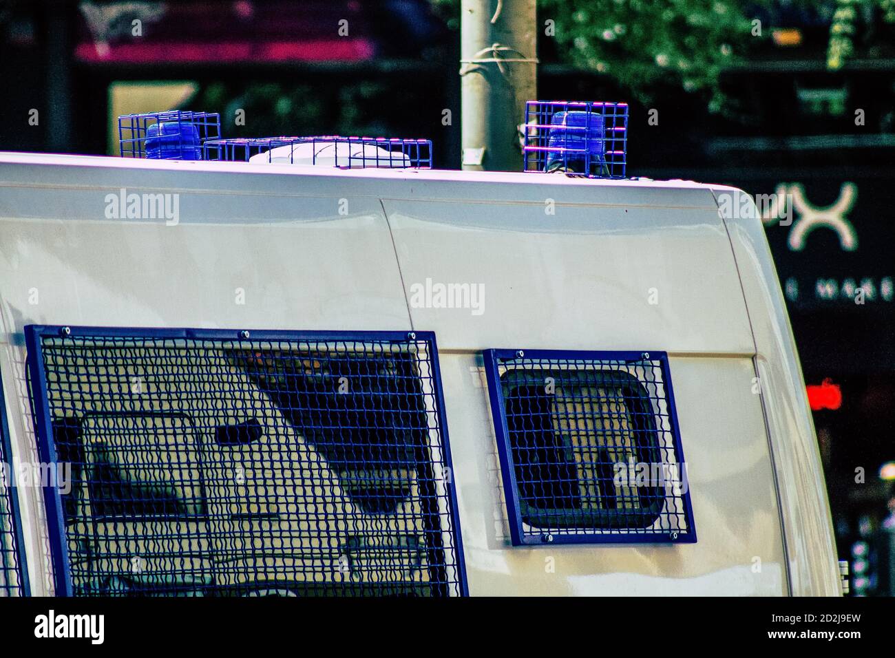 Closeup of an official police car patrolling the streets of the city ...