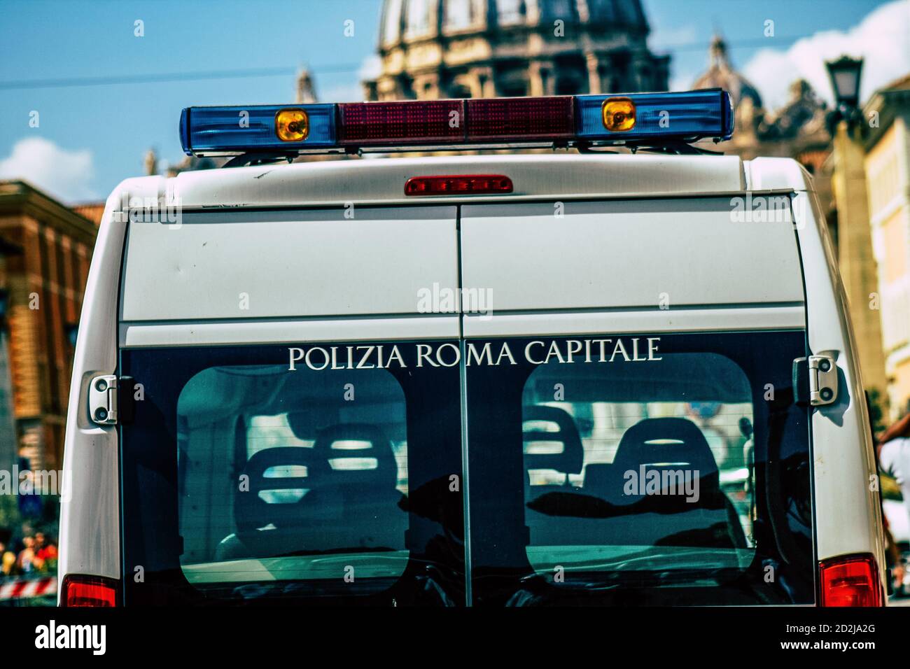 Closeup of an official police car patrolling the streets of the city ...