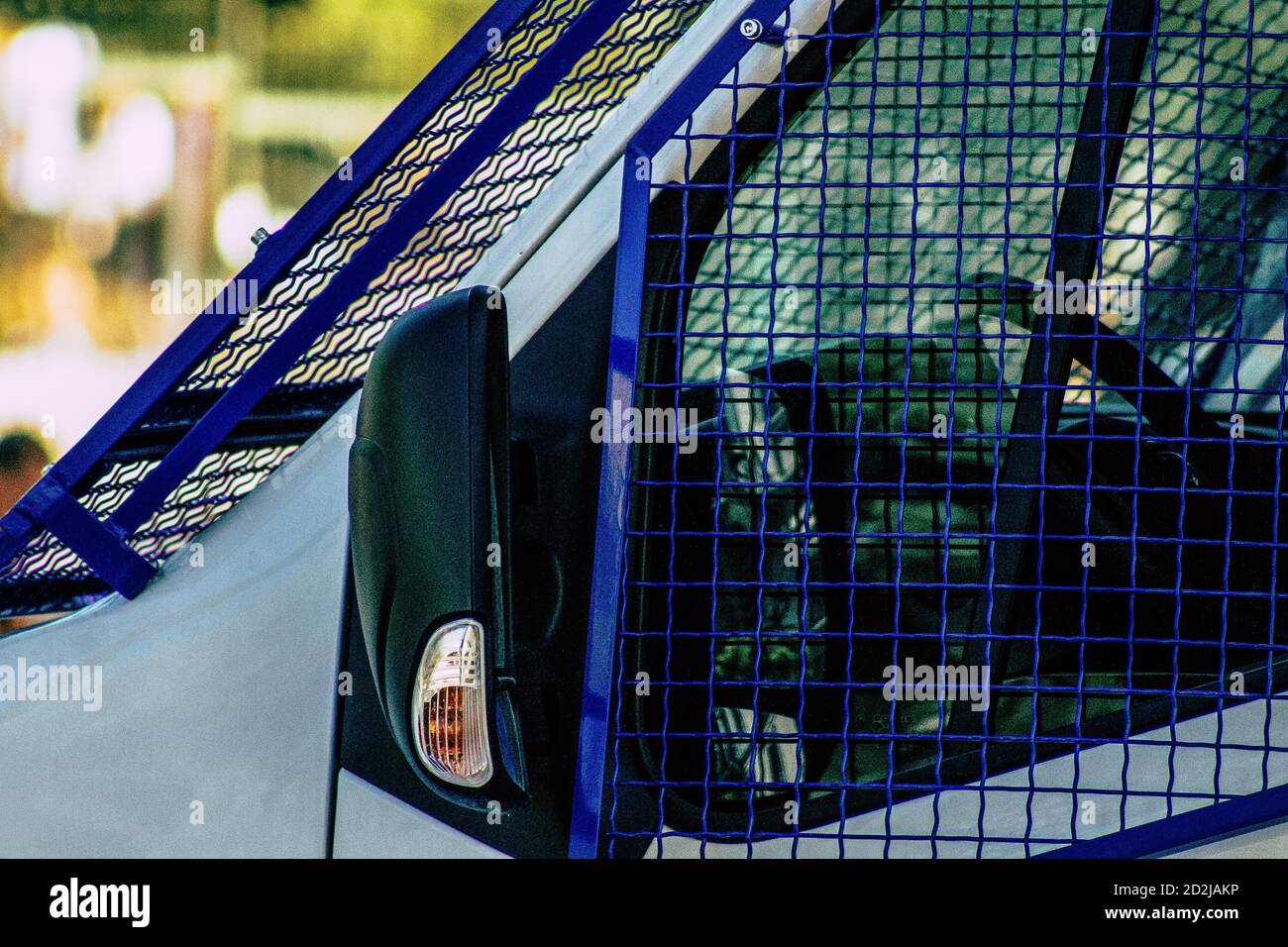 Closeup of an official police car patrolling the streets of the city ...