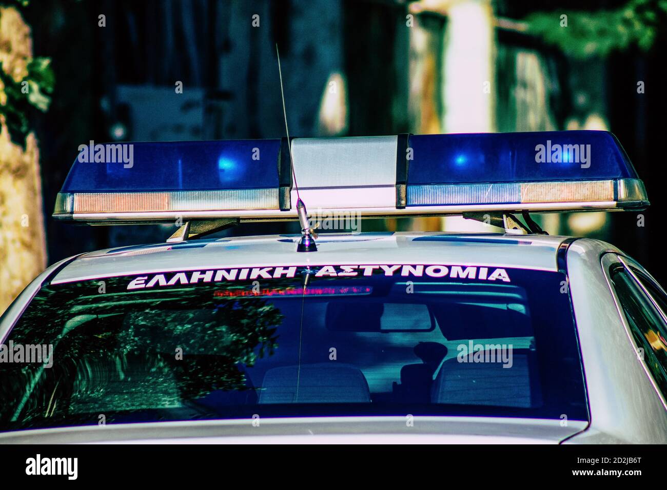 Closeup of an official police car patrolling the streets of the city ...