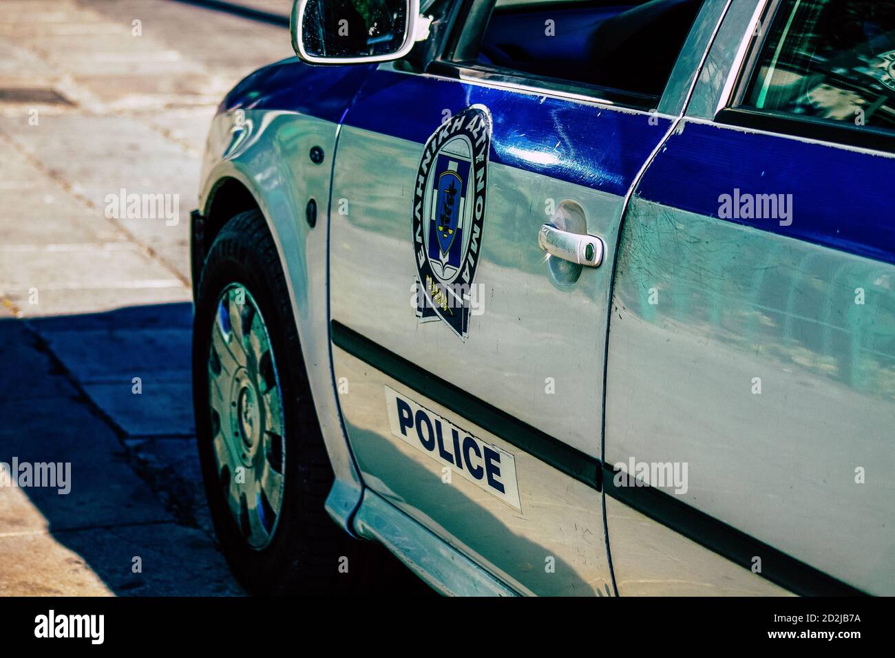 Closeup of an official police car patrolling the streets of the city ...