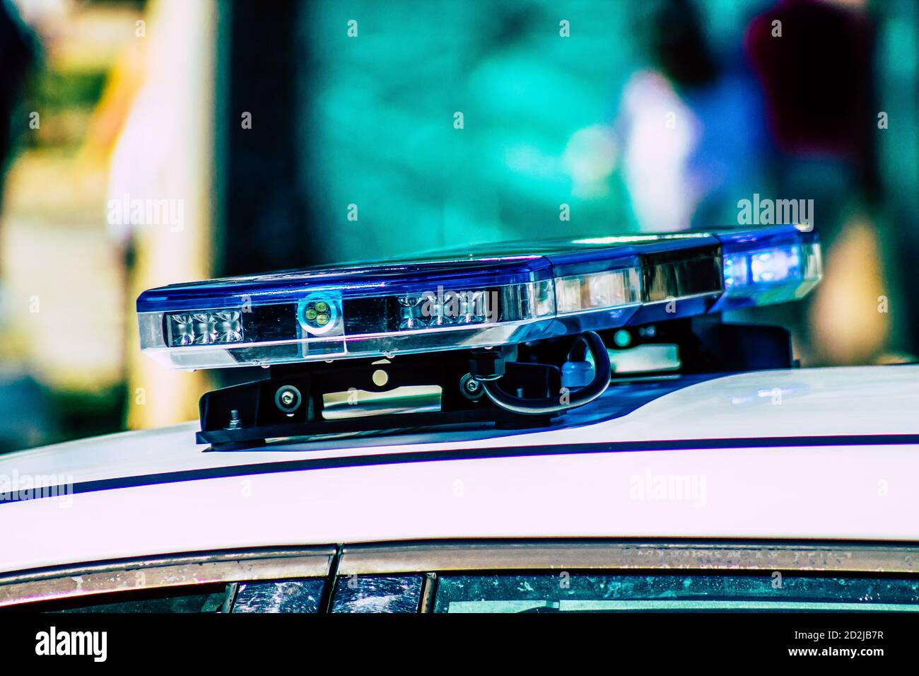 Closeup of an official police car patrolling the streets of the city ...