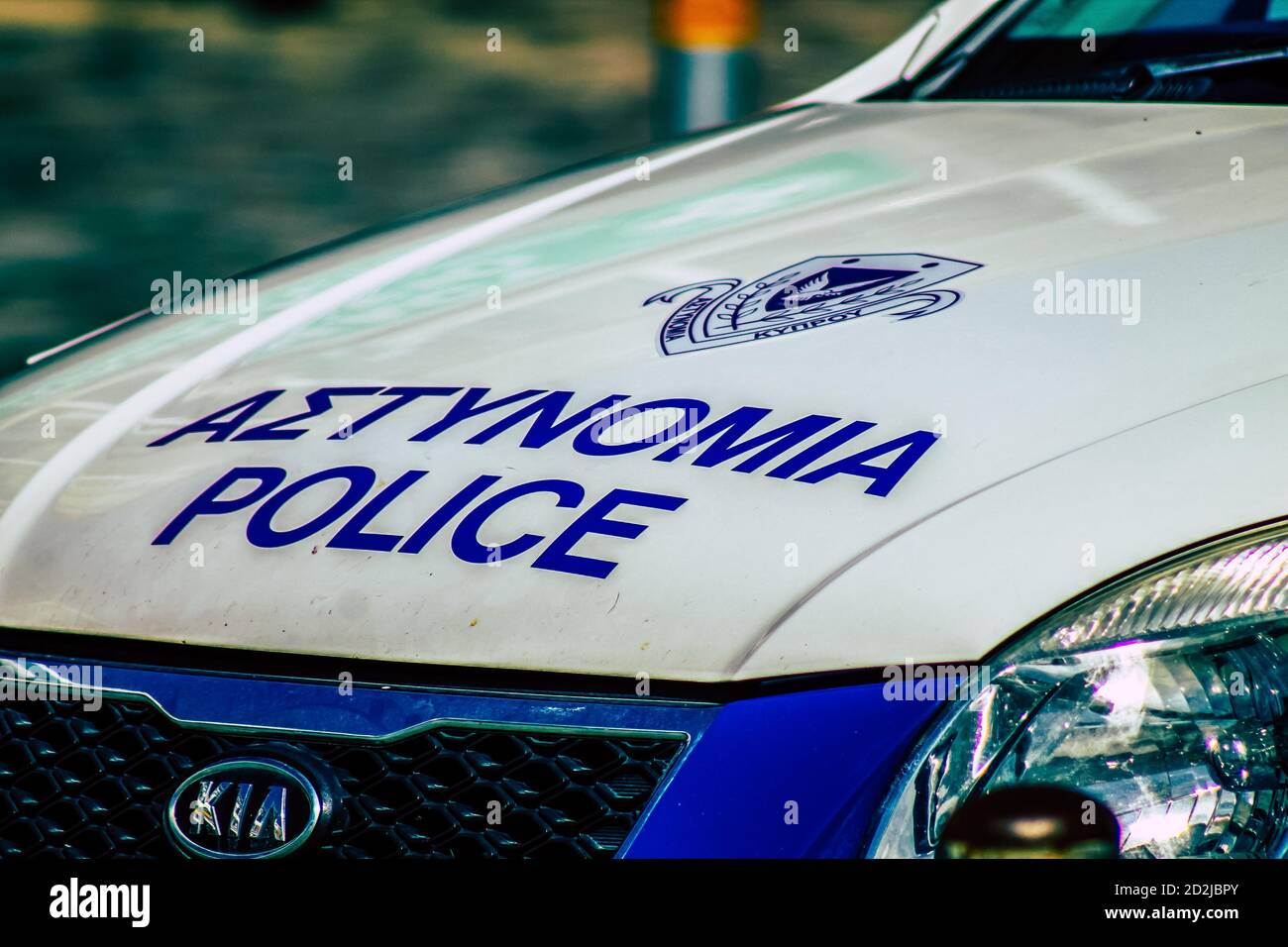 Closeup of an official police car patrolling the streets of the city ...