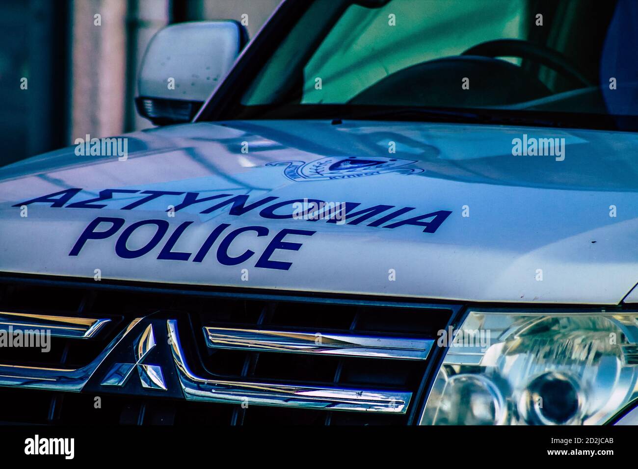 Closeup of an official police car patrolling the streets of the city ...