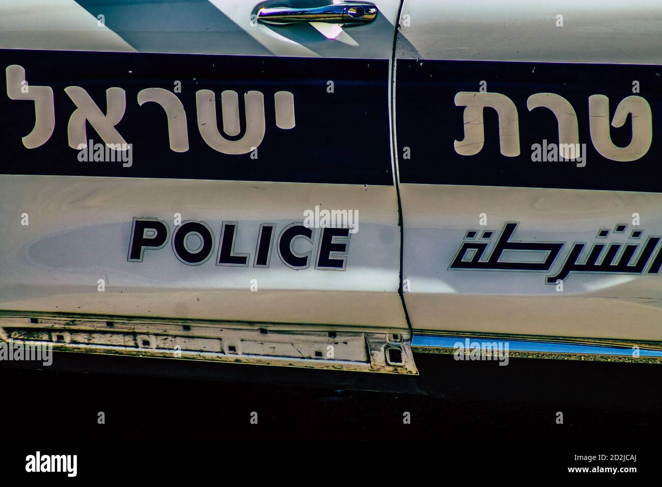 Closeup of an official police car patrolling the streets of the city ...