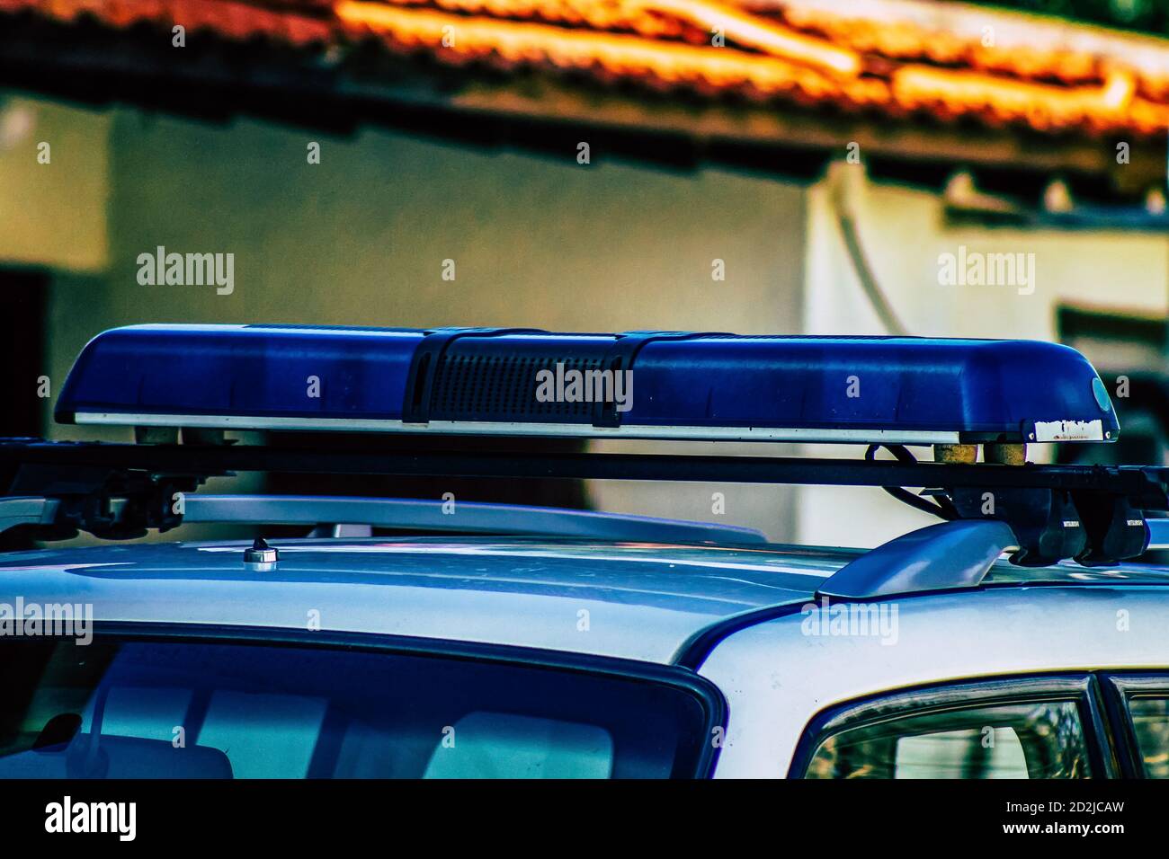 Closeup of an official police car patrolling the streets of the city ...