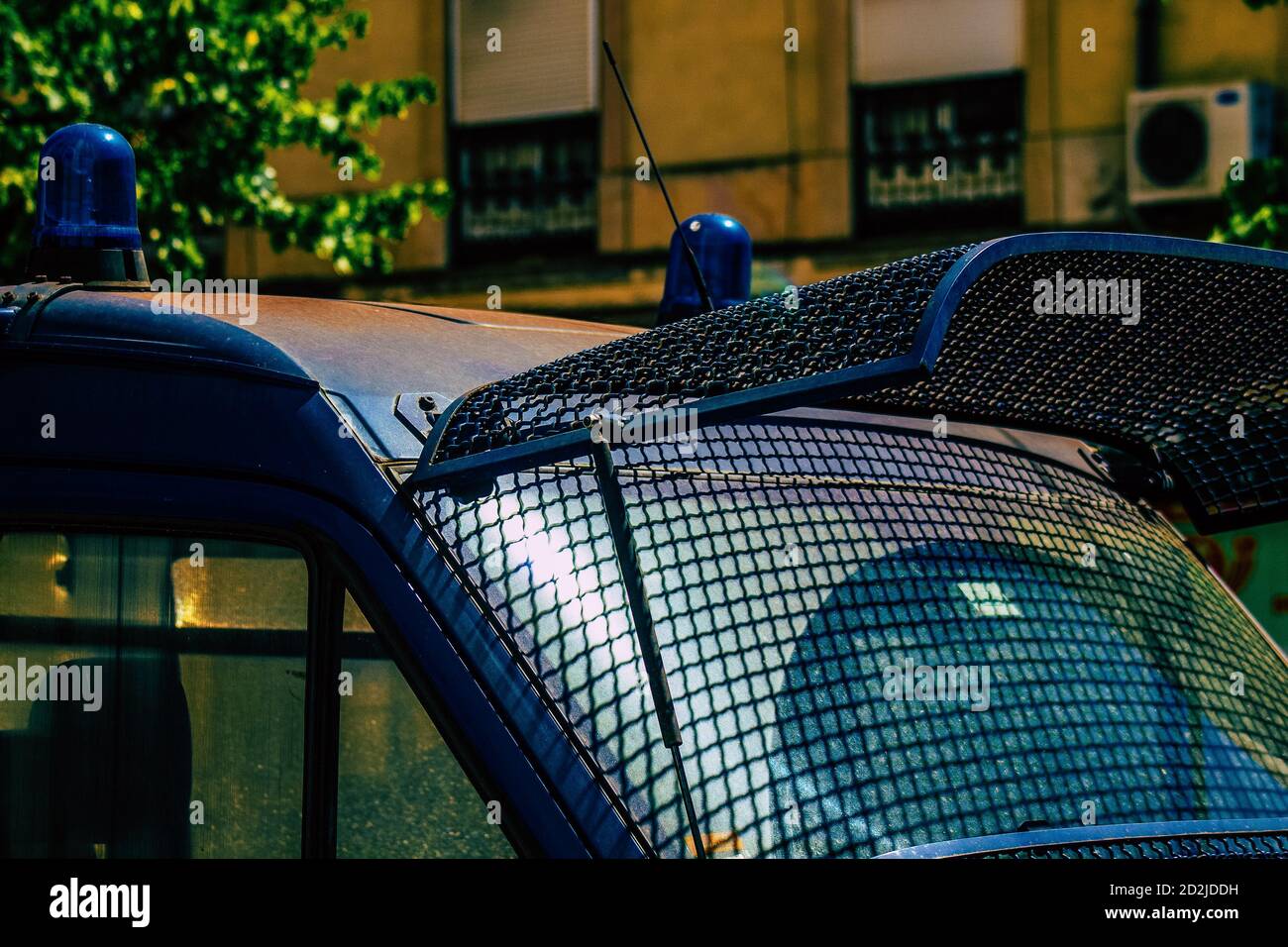 Closeup of an official police car patrolling the streets of the city ...