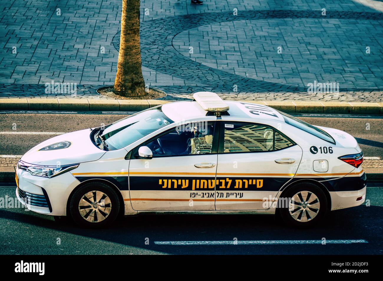 Closeup of an official police car patrolling the streets of the city ...