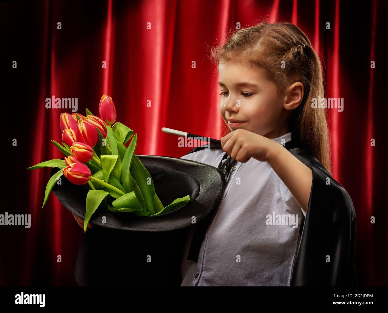the little magician does tricks Stock Photo - Alamy