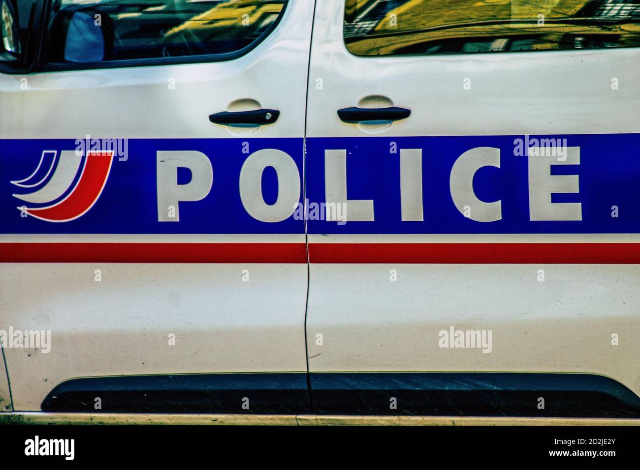 Closeup of an official police car patrolling the streets of the city ...