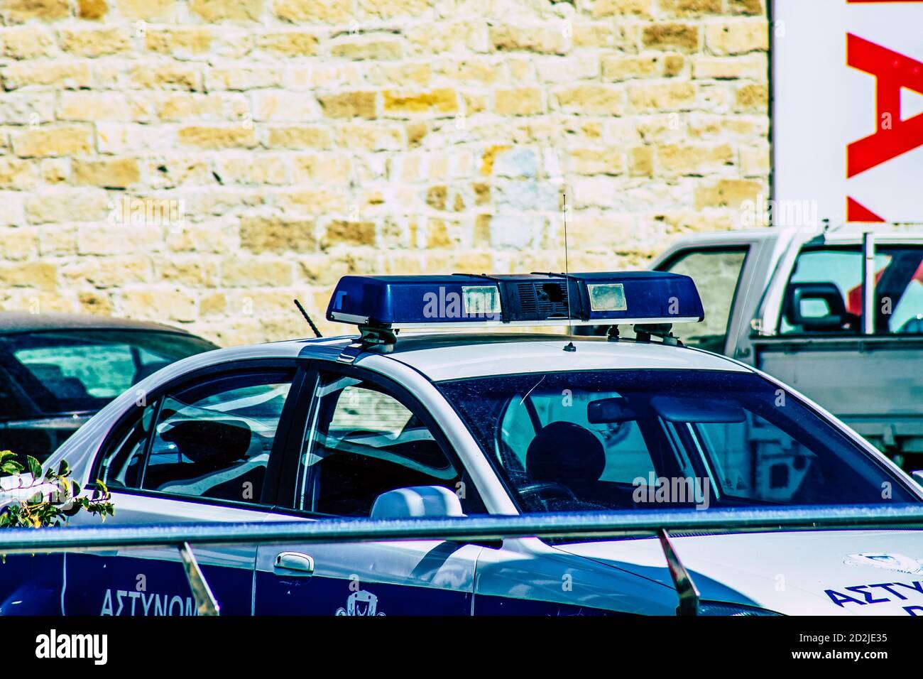 Closeup of an official police car patrolling the streets of the city ...