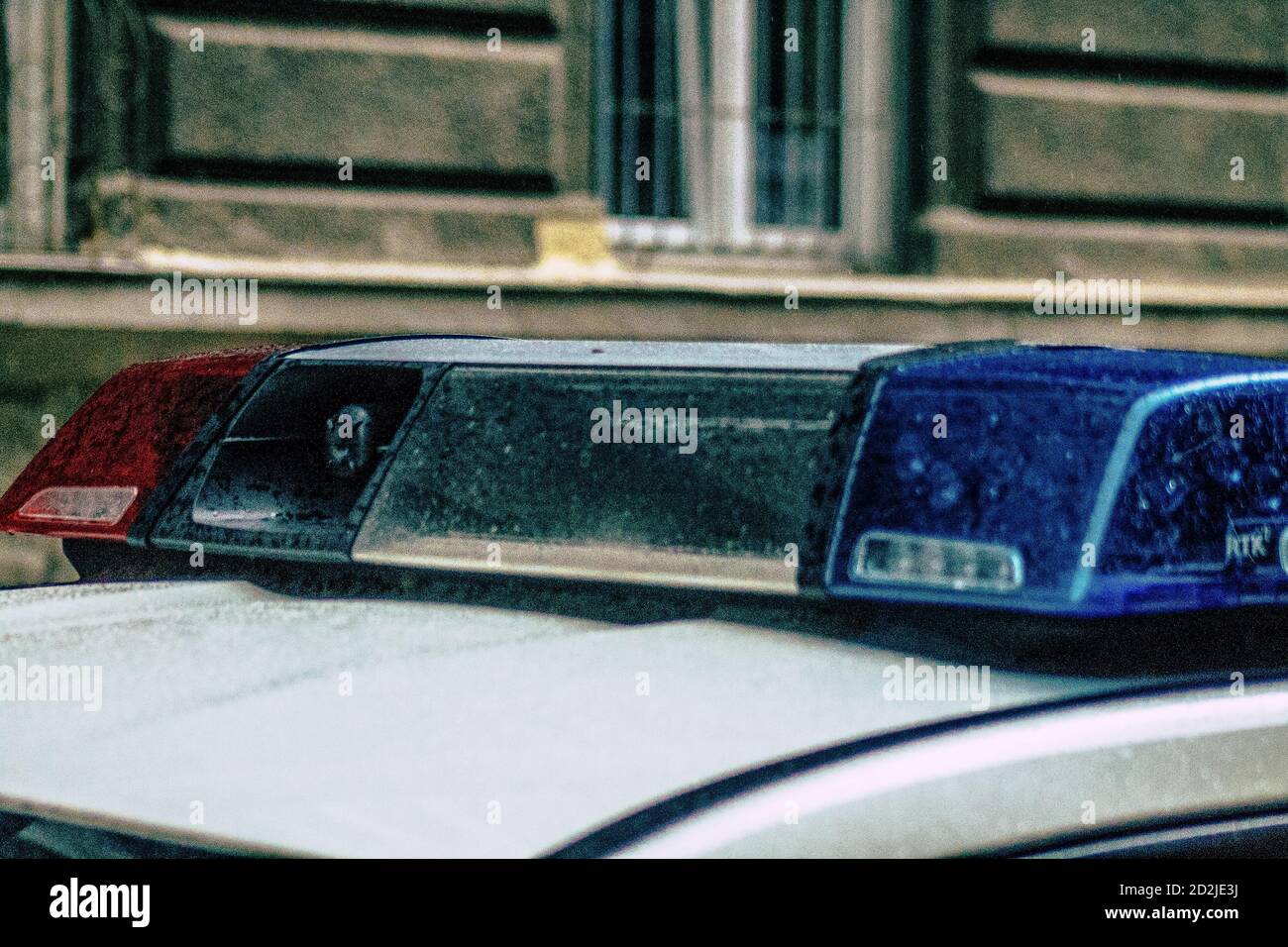 Closeup of an official police car patrolling the streets of the city ...