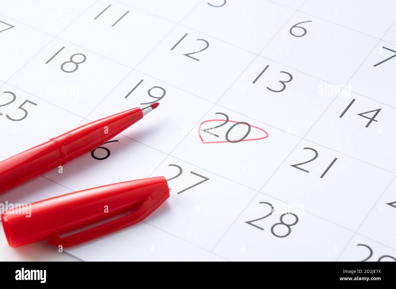 Mark your calendar with a red pen Stock Photo - Alamy