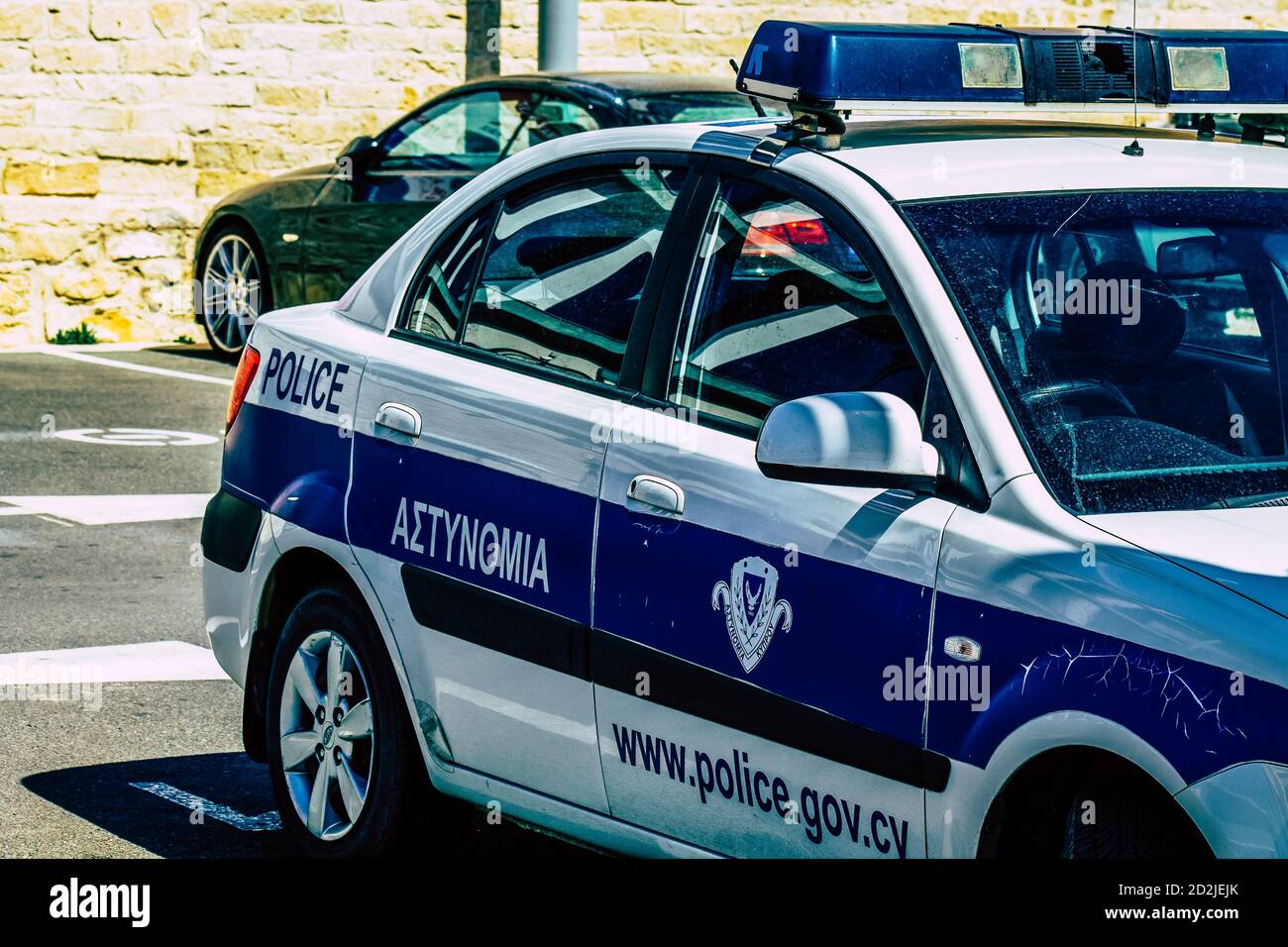 Closeup of an official police car patrolling the streets of the city ...